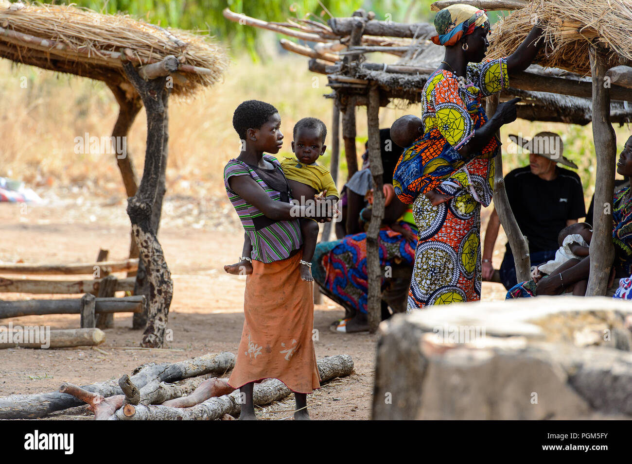KOUTAMMAKOU, TOGO - JAN 13, 2017: Unidentified Togolese girl carries a ...