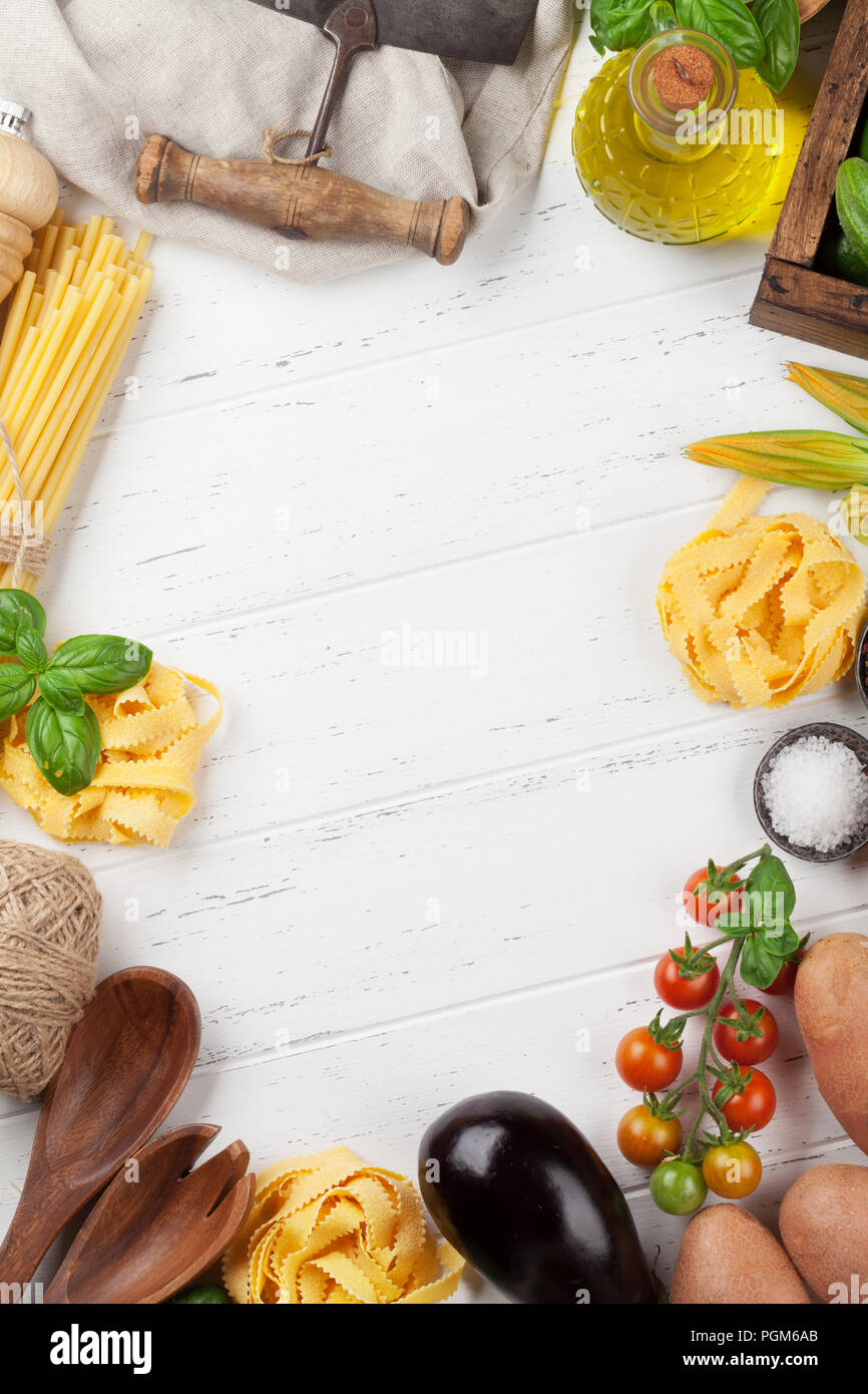 Pasta with fresh garden tomatoes and cucumbers with herbs cooking on ...