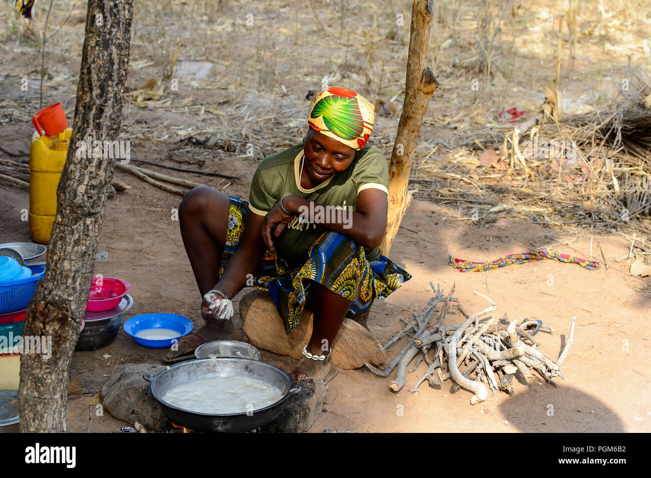 KOUTAMMAKOU, TOGO - JAN 13, 2017: Unidentified Togolese woman cooks on ...