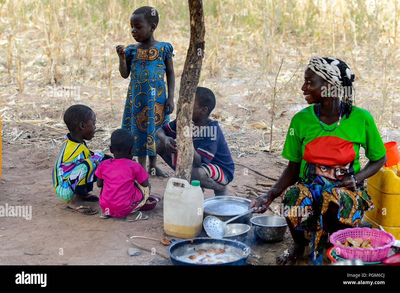 KOUTAMMAKOU, TOGO - JAN 13, 2017: Unidentified Togolese children squat ...