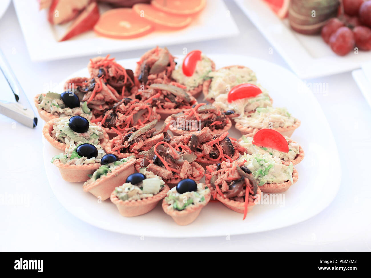 catering table set service with silverware and glass stemware in the ...