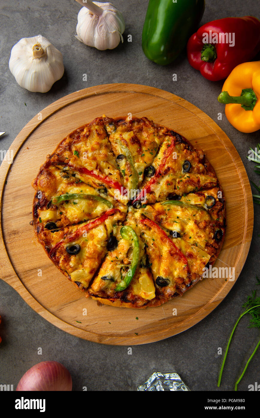 italian pizza with rustic background Stock Photo - Alamy