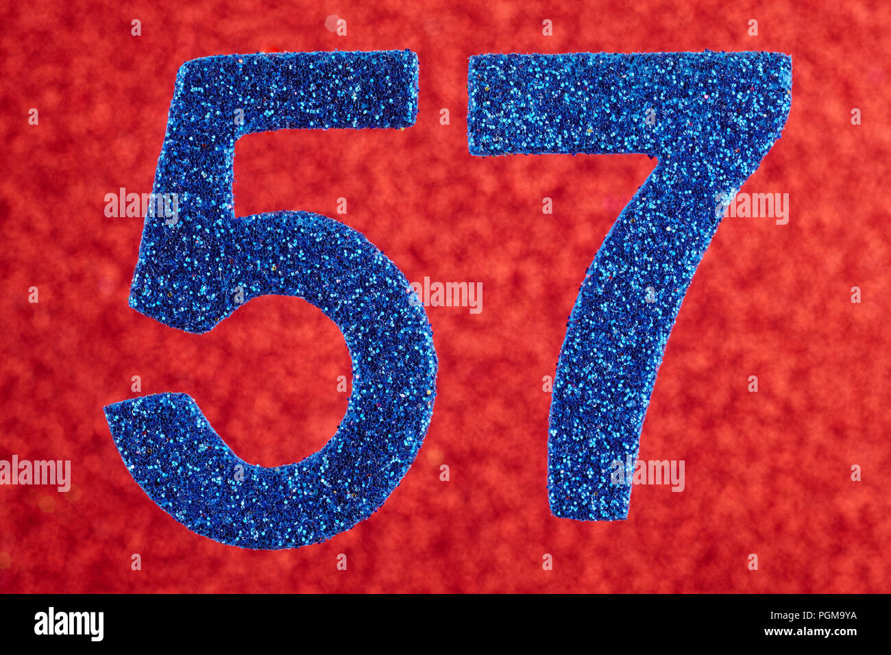 Number fifty-seven blue color over a red background. Anniversary ...