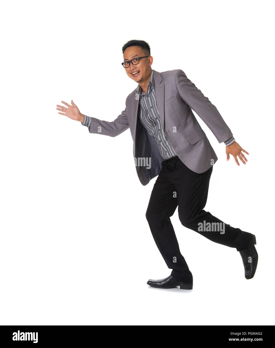 happy young business man running Stock Photo - Alamy