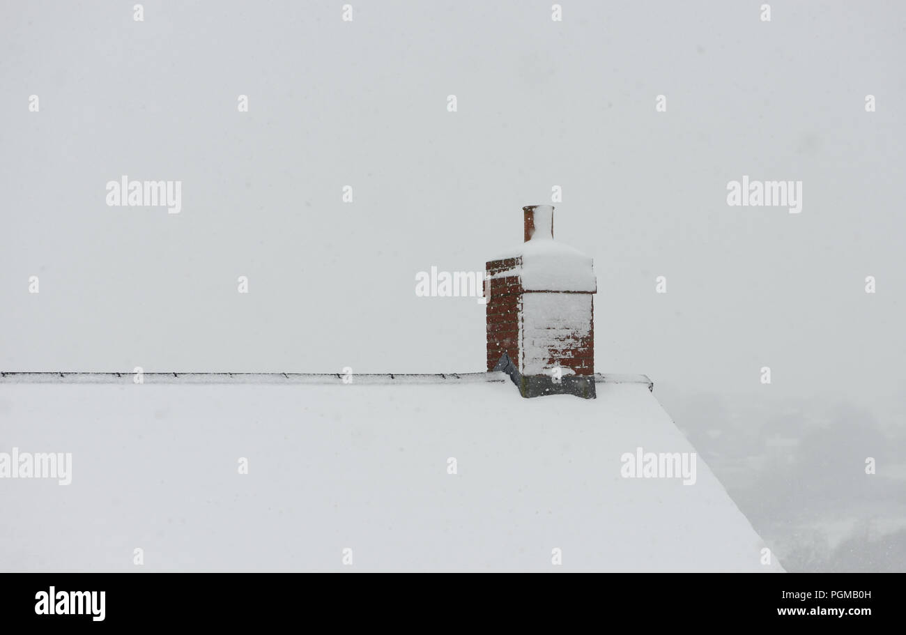 Rooftop chimney in the snow Stock Photo - Alamy
