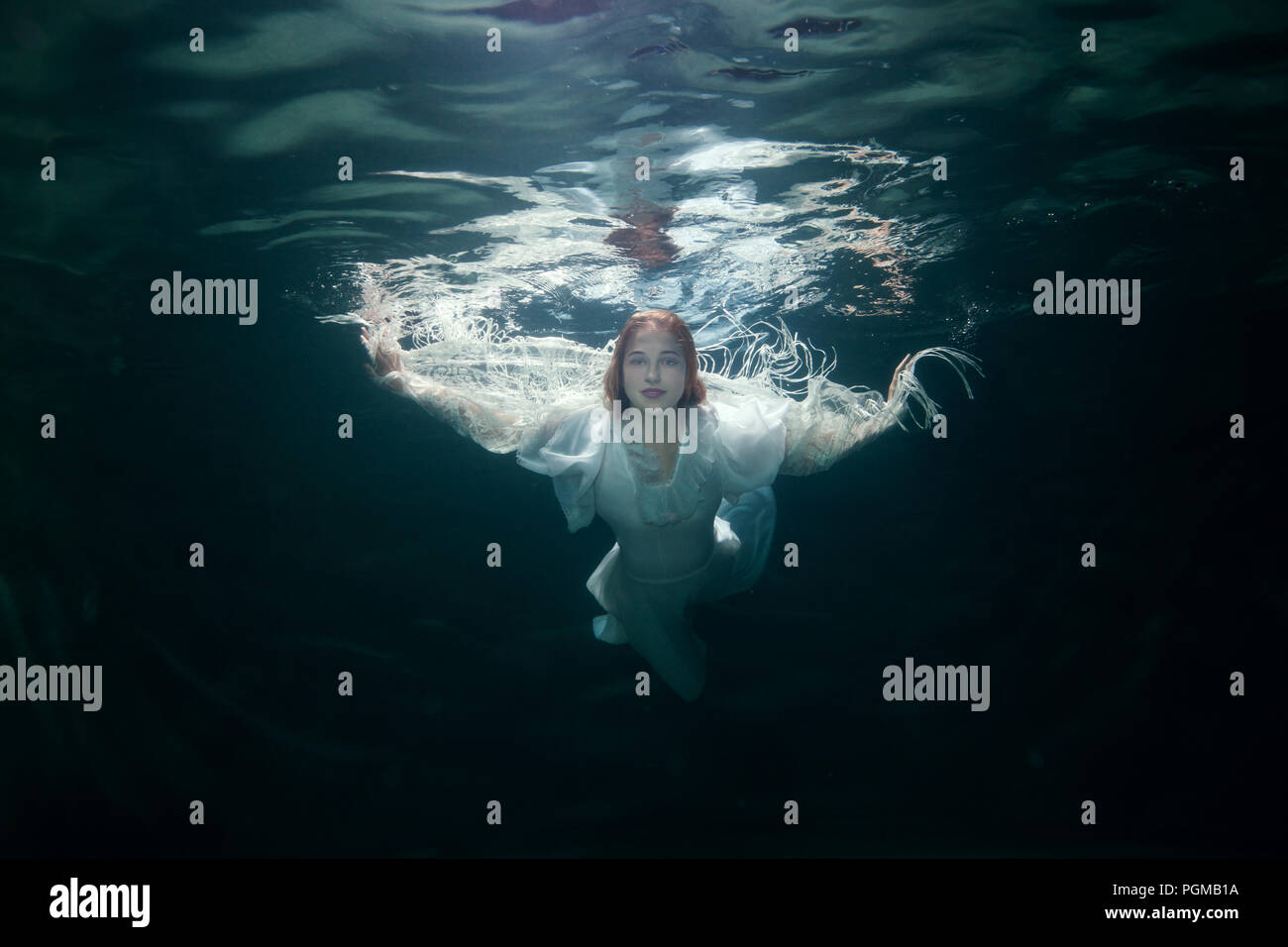 Portrait of a beautiful woman in a white dress under the water Stock ...
