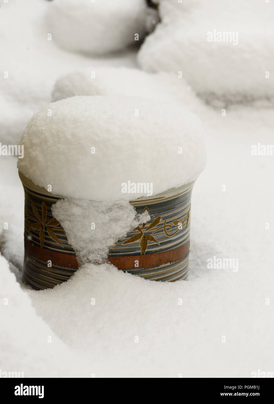 Snow-covered flower pots Stock Photo - Alamy