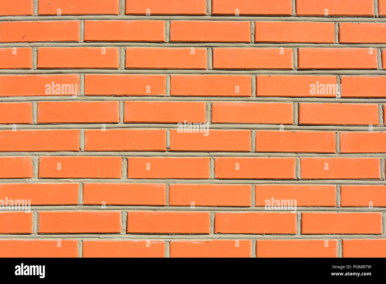 Beautiful masonry of red bricks, a wall of building bricks and gray ...