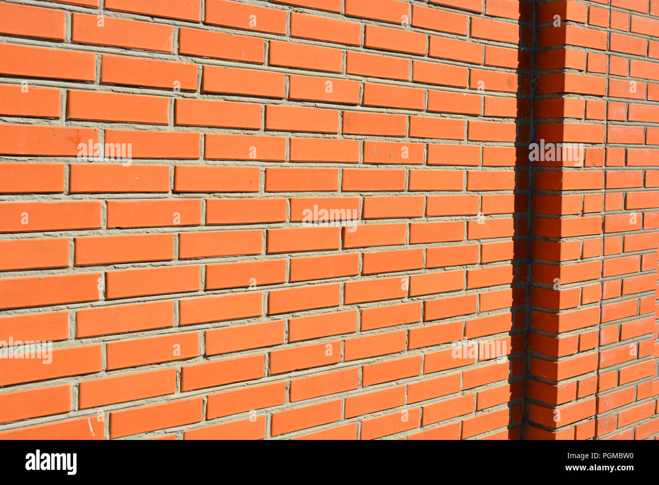 Beautiful masonry of red bricks, a wall of building bricks and gray ...