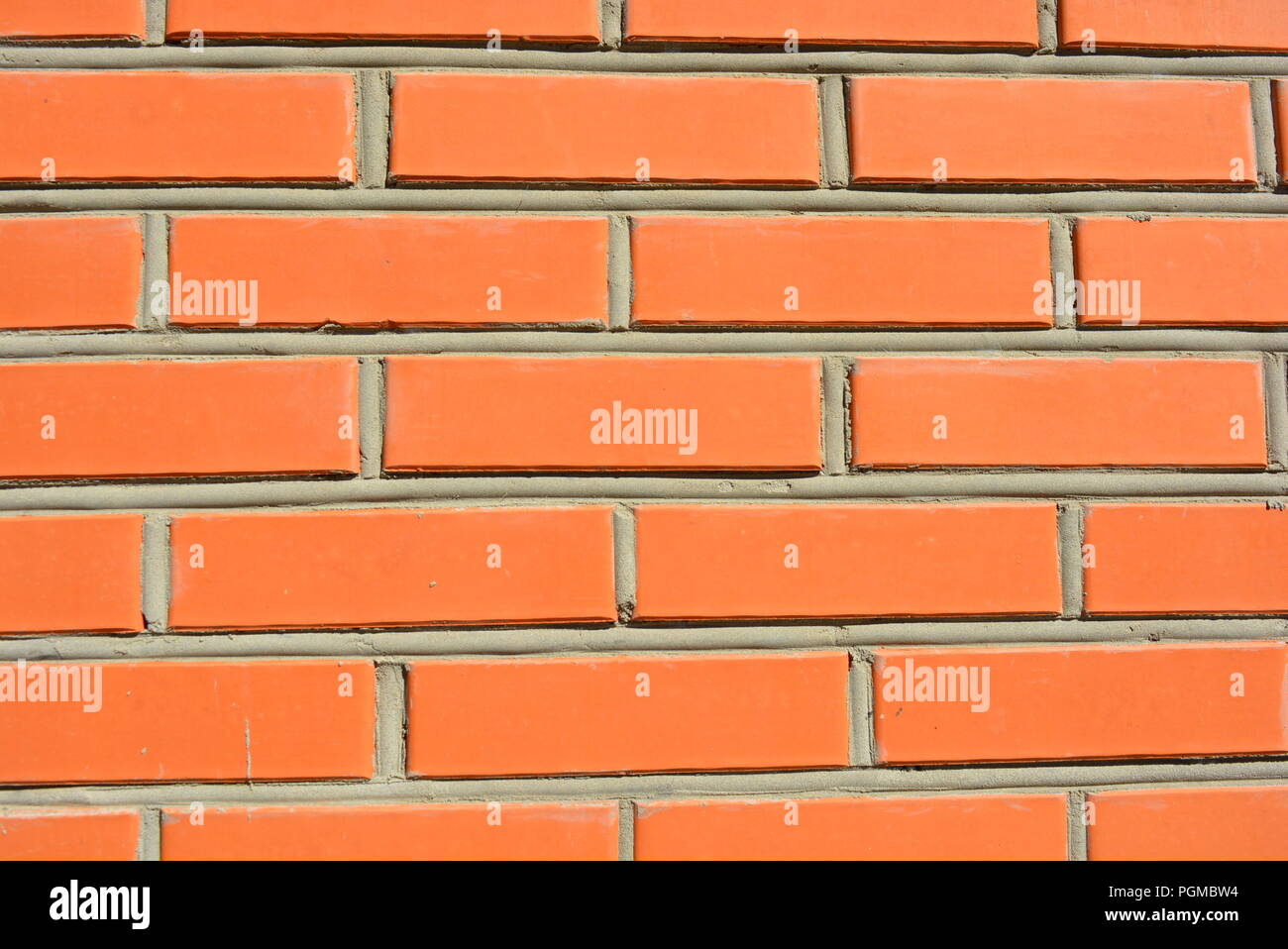 Beautiful masonry of red bricks, a wall of building bricks and gray ...