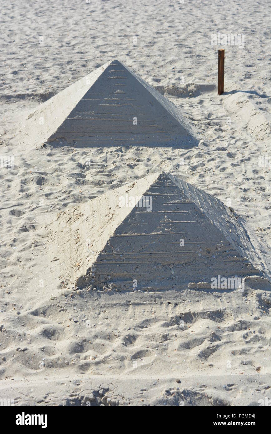 Made two pyramids of white sand and sea shells on the Black Sea beach ...