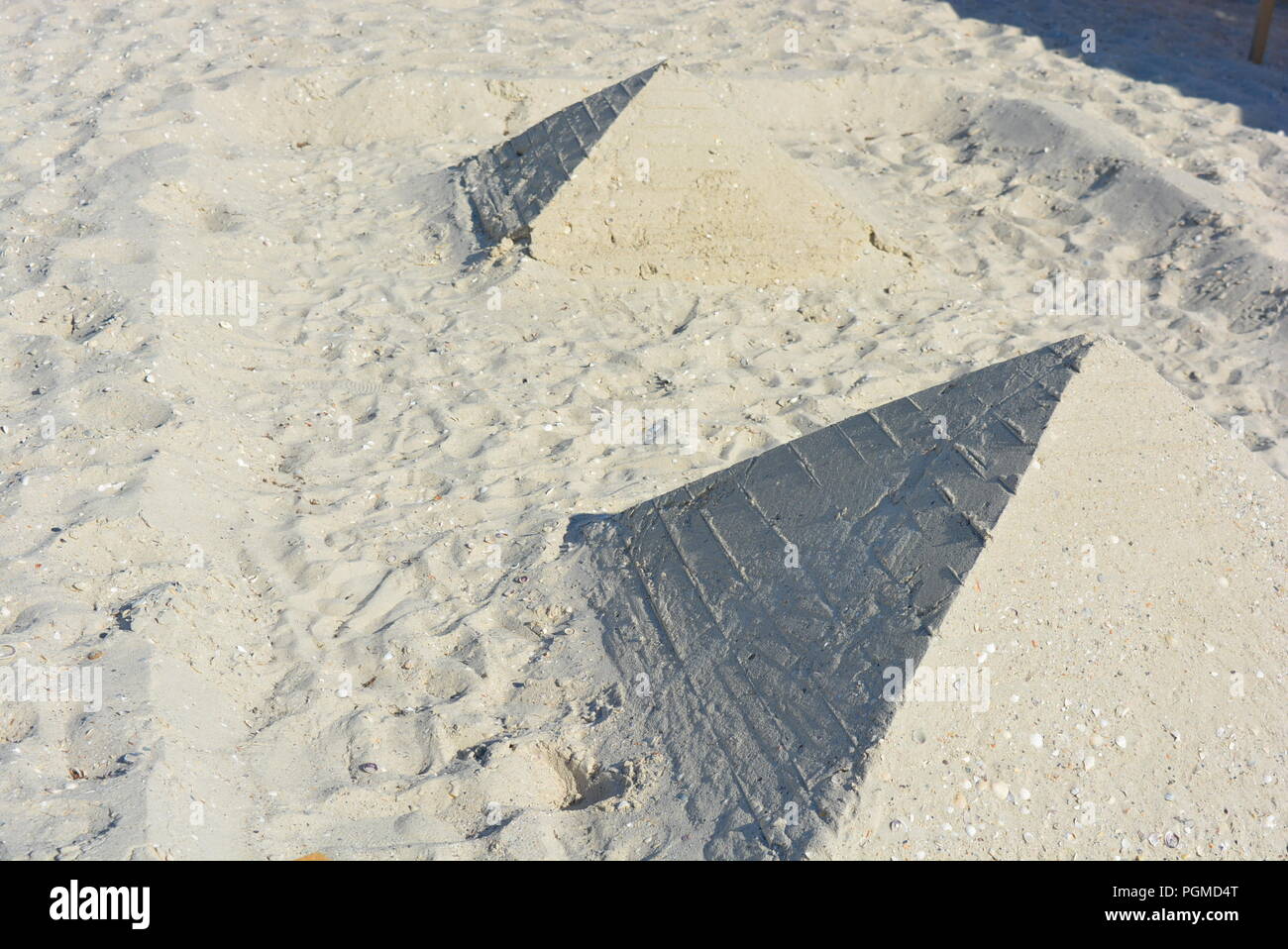 Made two pyramids of white sand and sea shells on the Black Sea beach ...