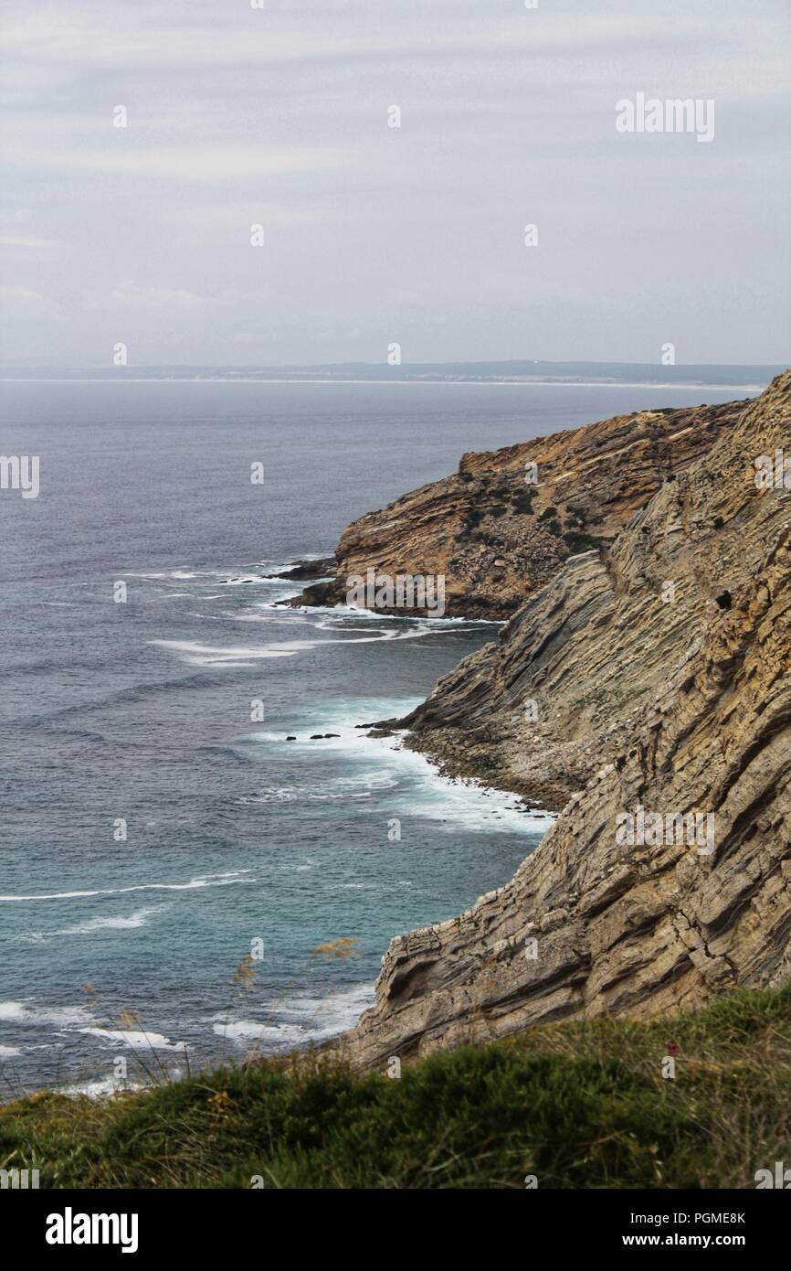 Views of the wild Atlantic Ocean with beautiful cliffs in Cape Espichel, Portugal Stock Photo ...