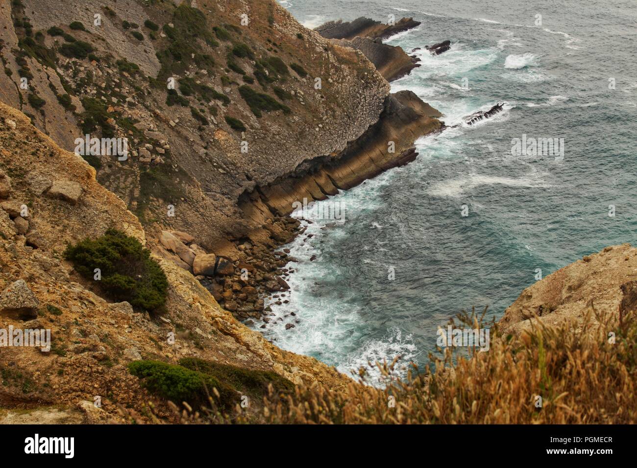 Views of the wild Atlantic Ocean with beautiful cliffs in Cape Espichel, Portugal Stock Photo ...