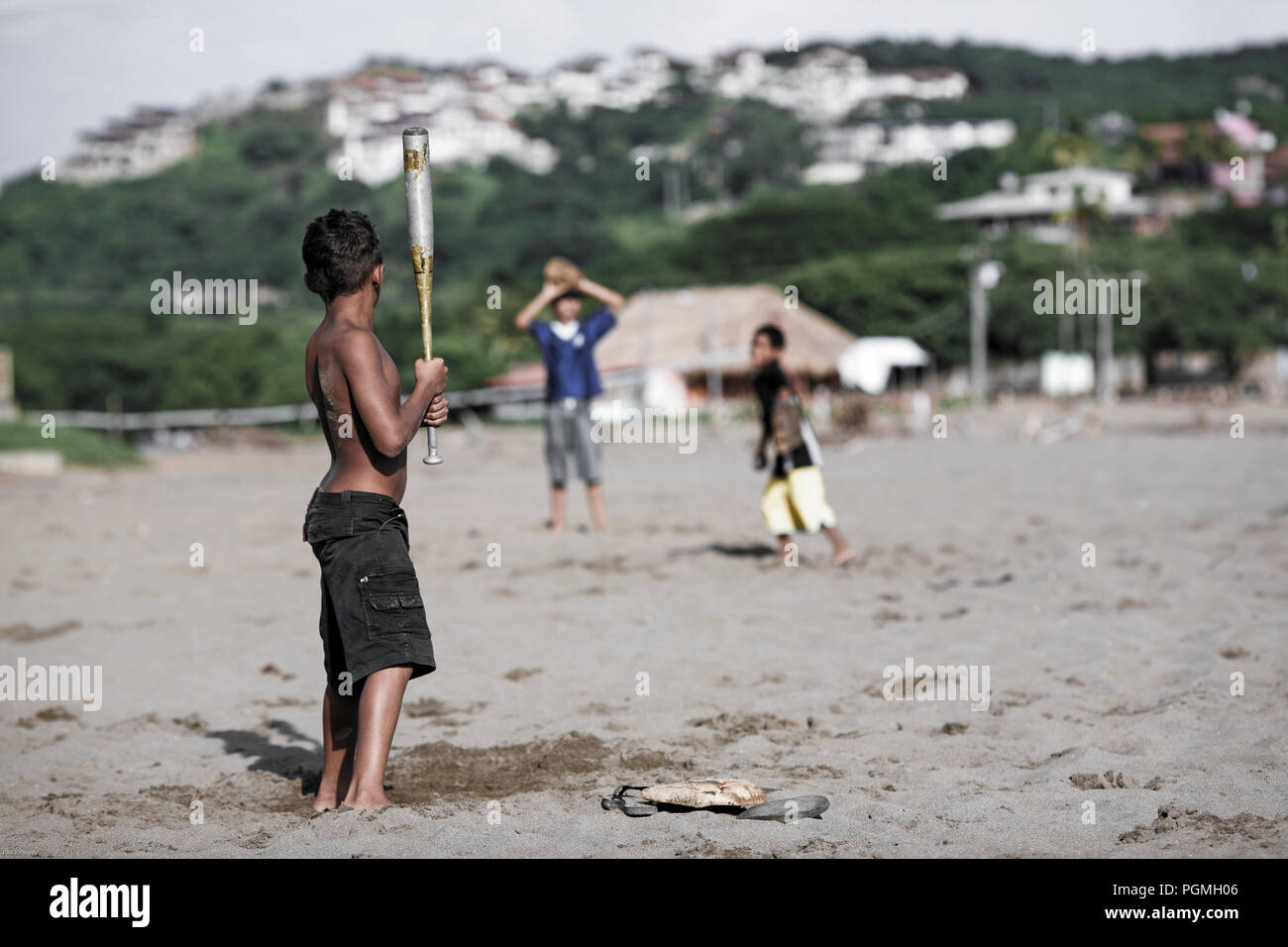 Boys playing baseball on beach in San Juan Del Sur, Nicaragua Stock ...