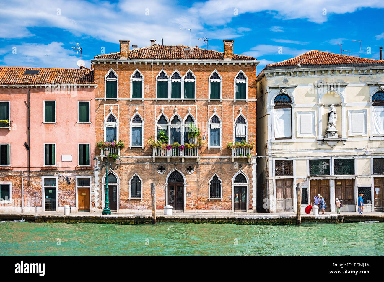 Colourful homes and apartment buildings along the Grand Canal in Venice ...