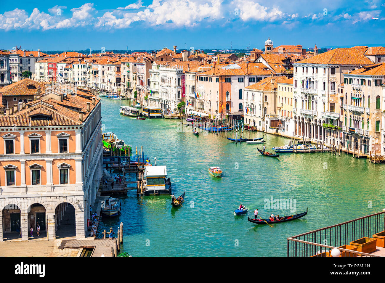 An aerial view of the iconic grand canal with gondolas in front of ...