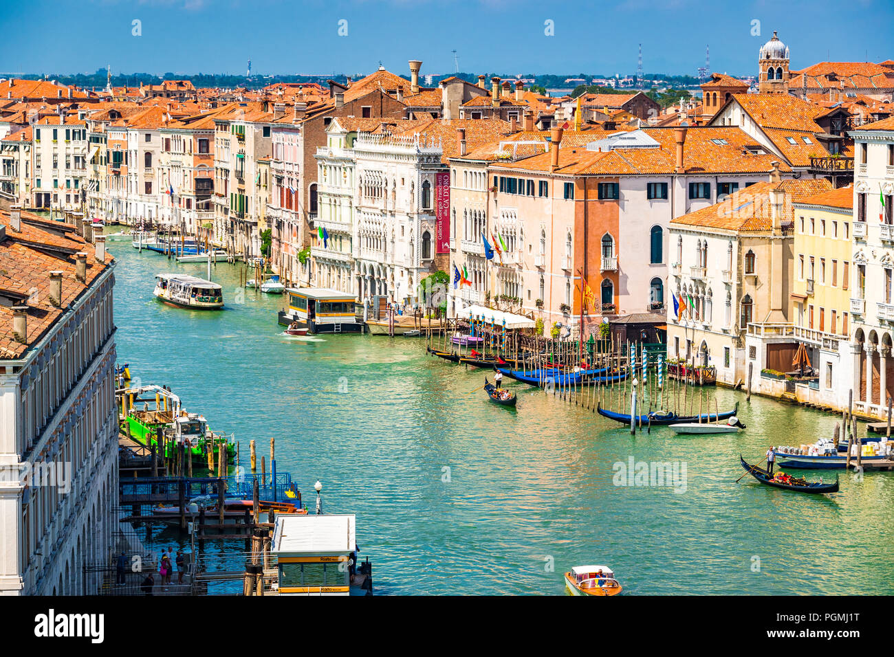 An aerial view of the iconic grand canal with gondolas in front of ...