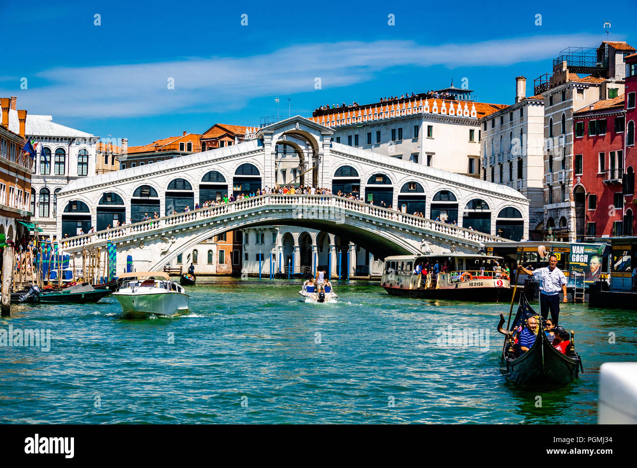 The famous Rialto Bridge, also known as Ponte di Rialto and a gondola ...