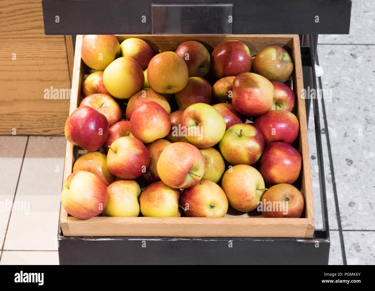 Full wooden box shelf with healthy red apples on the market Stock Photo ...