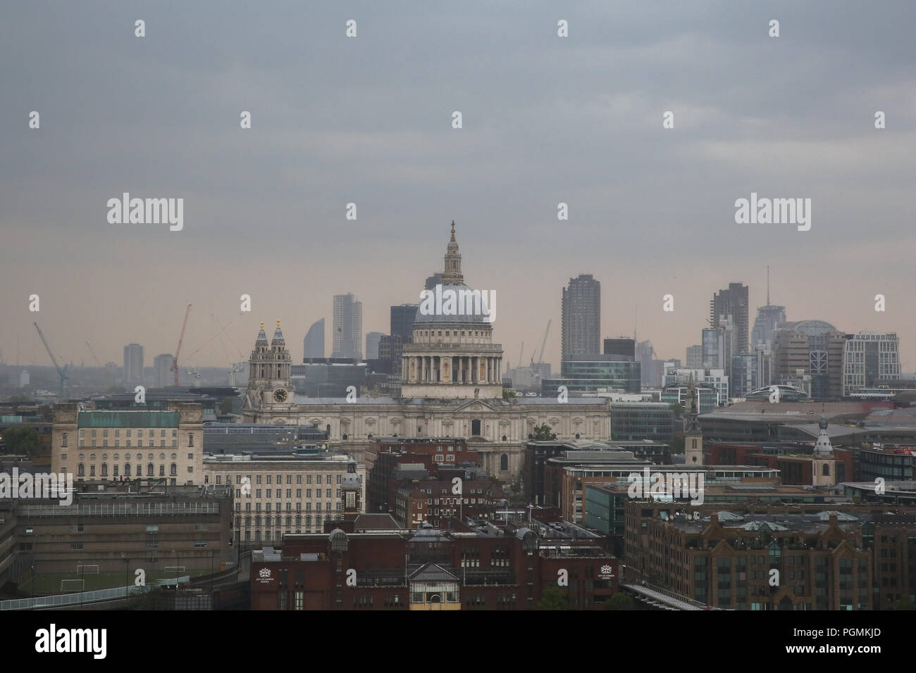 Dark clouds over London’s skyline as it starts to rain in London after ...