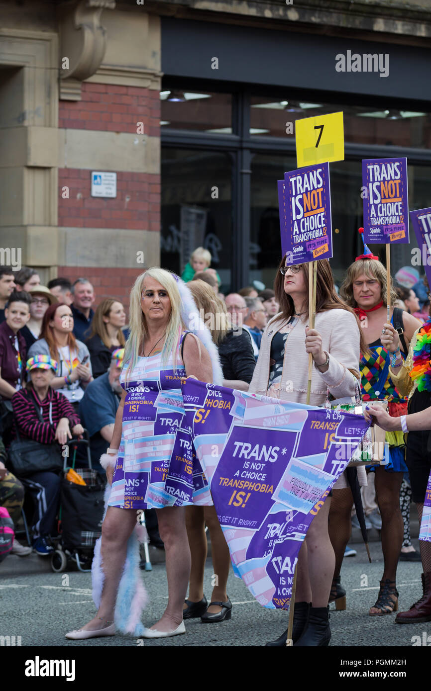 Transgender people with placards saying "Trans is not a choice ...