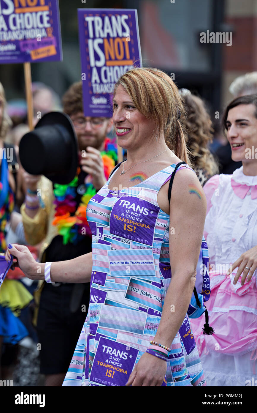 Transgender people with placards saying "Trans is not a choice ...