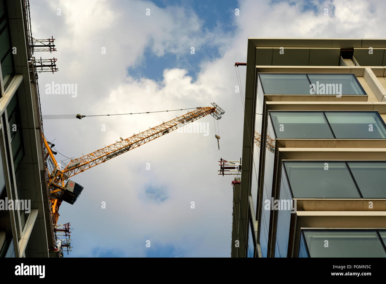 Tower crane at construction site of skyscraper Stock Photo - Alamy