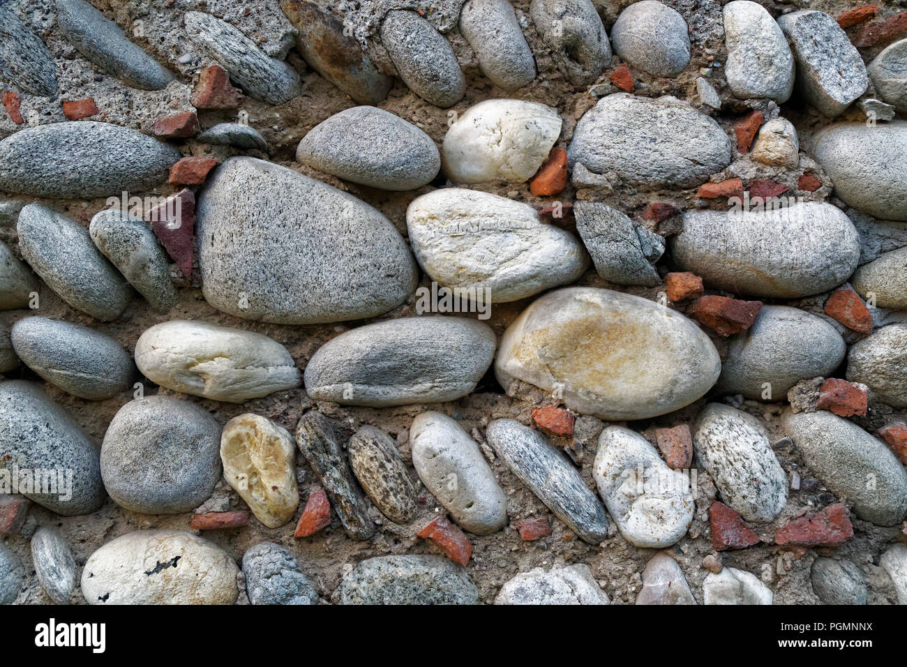 Pebbles ancient wall background,closeup big stones Stock Photo - Alamy