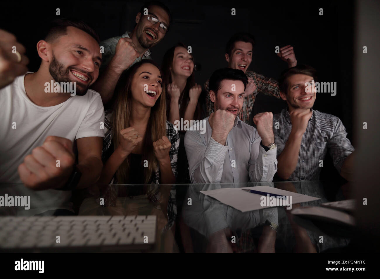 happy business team looking at computer monitor Stock Photo - Alamy