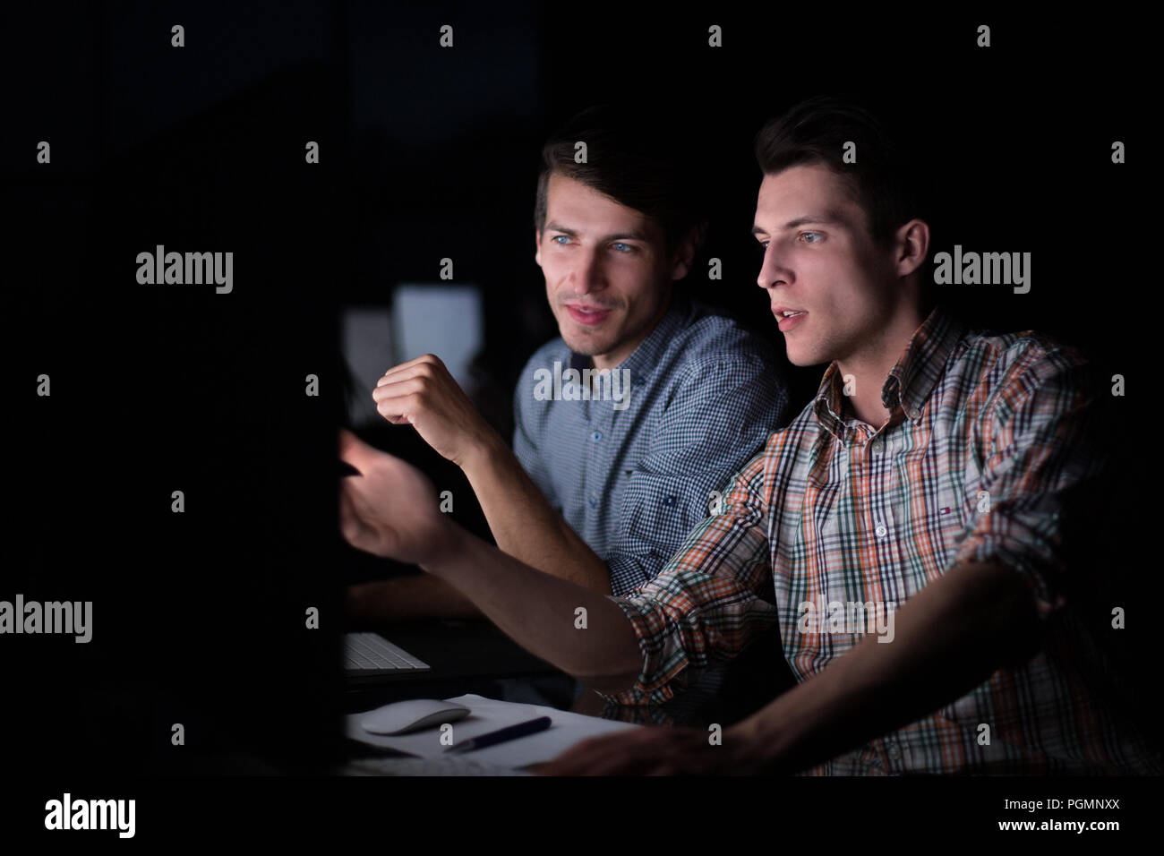 office staff working on the computer in the dark Stock Photo - Alamy