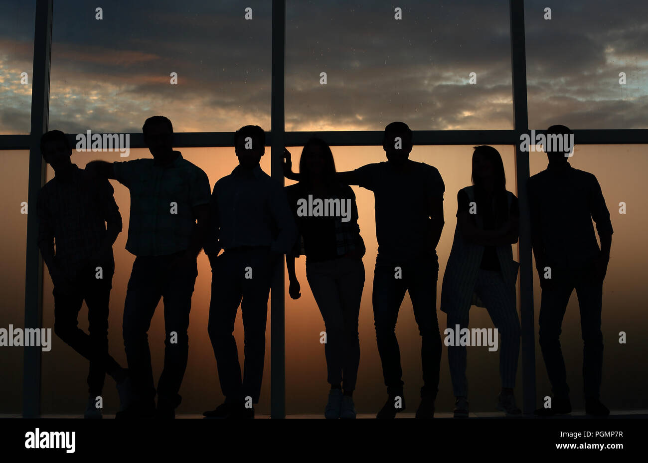 business team standing near the window, evening, dark Stock Photo - Alamy