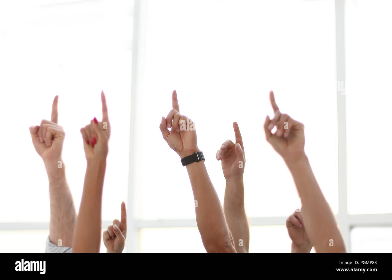 group of young people pointing upwards Stock Photo - Alamy
