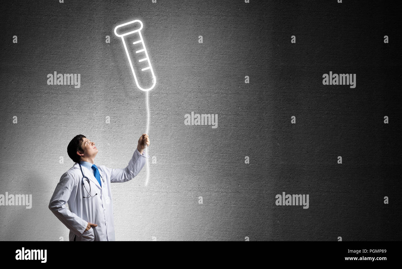 Doctor and vial symbol Stock Photo - Alamy