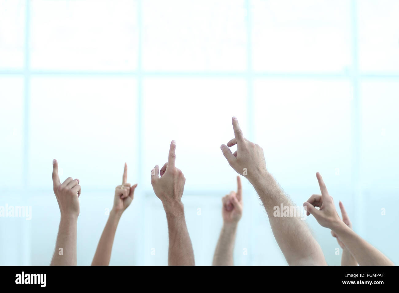 Business team pointing up hi-res stock photography and images - Alamy