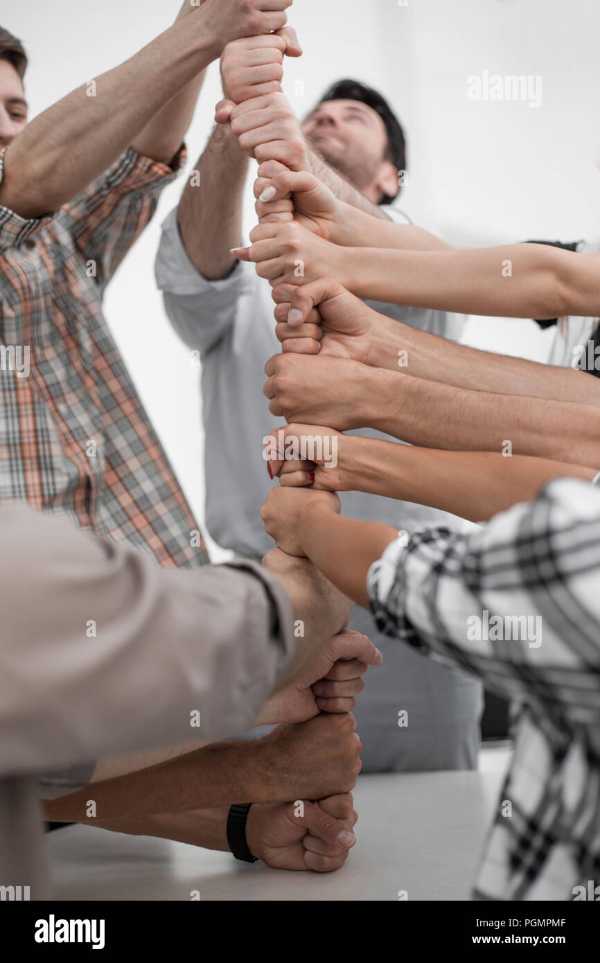 close up.the business team is holding on to a strong rope Stock Photo ...