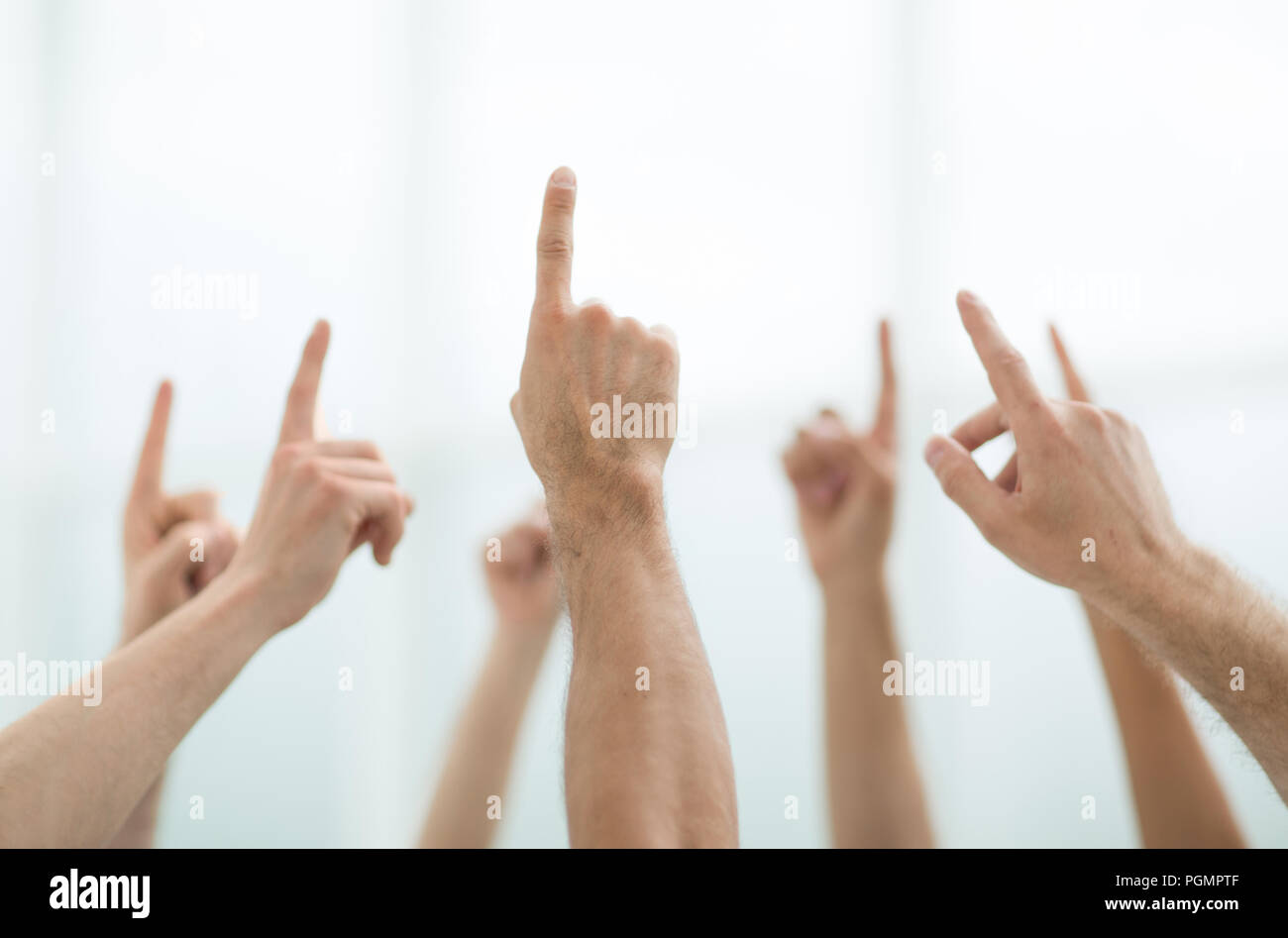 business team pointing fingers up Stock Photo - Alamy
