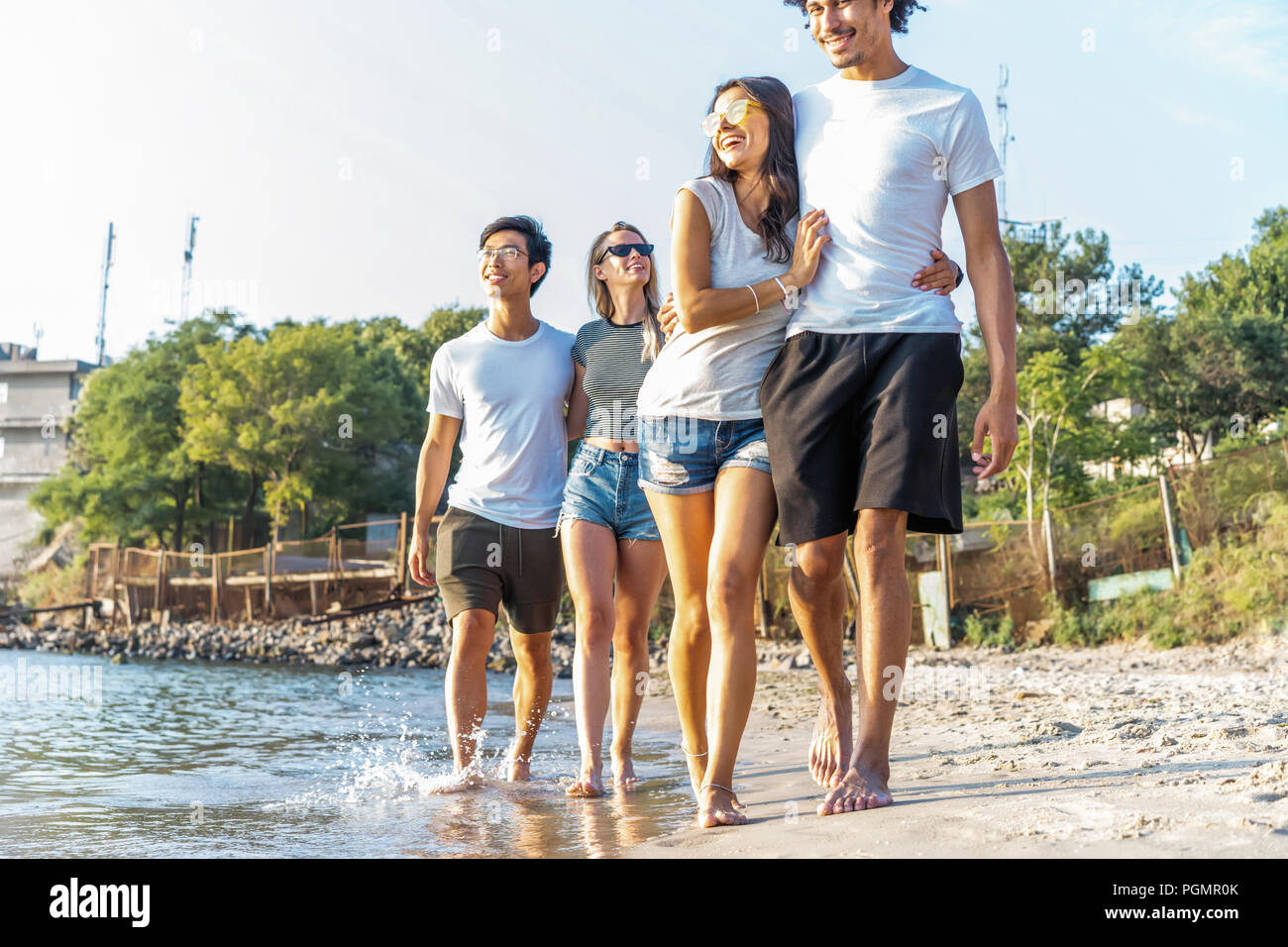 Young female running through waves hi-res stock photography and images ...