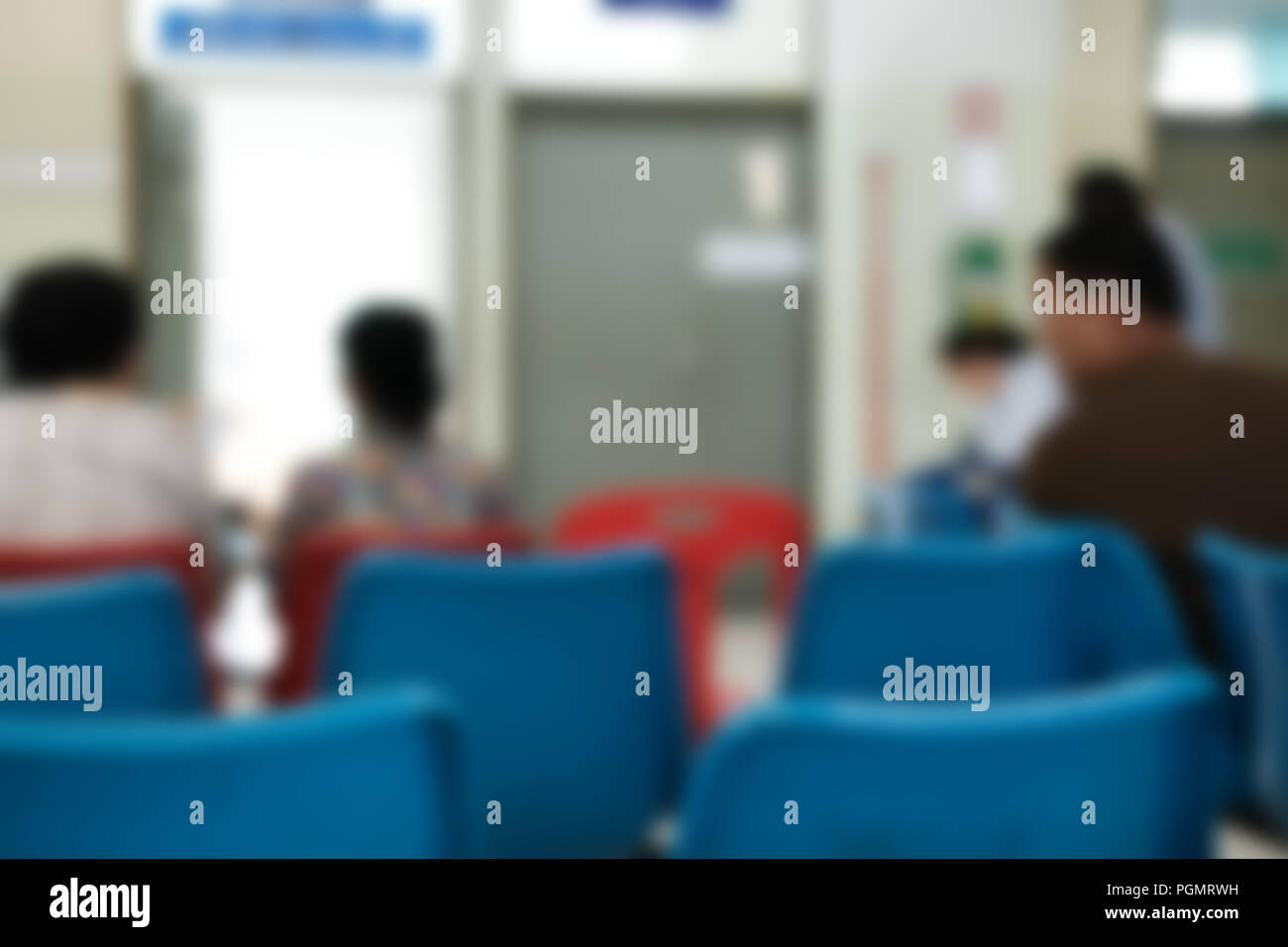 blue chair in in hospital. patient seat in waiting area in clinic. blur ...