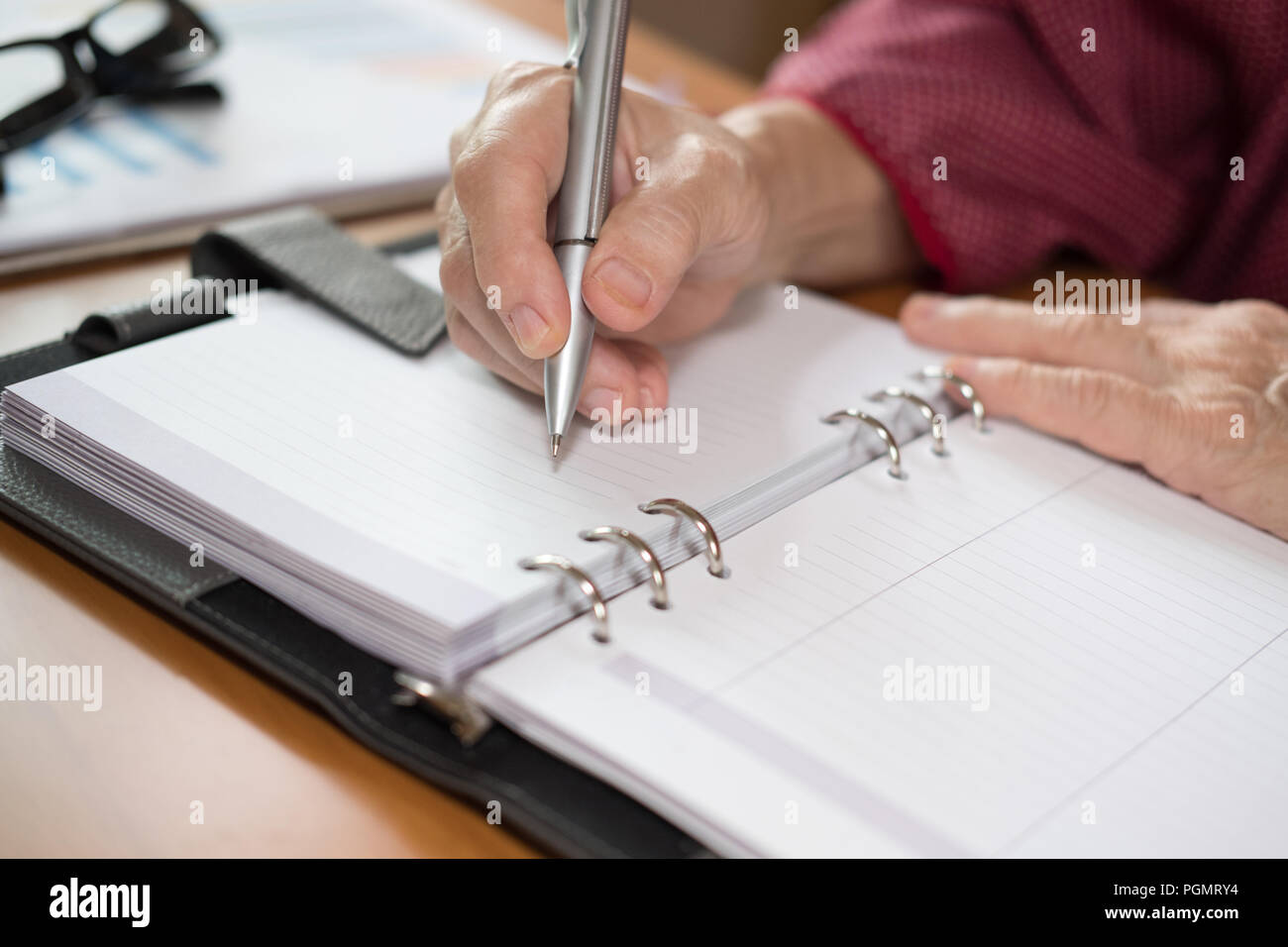 woman hand with pen writing note on notebook at office workplace Stock ...