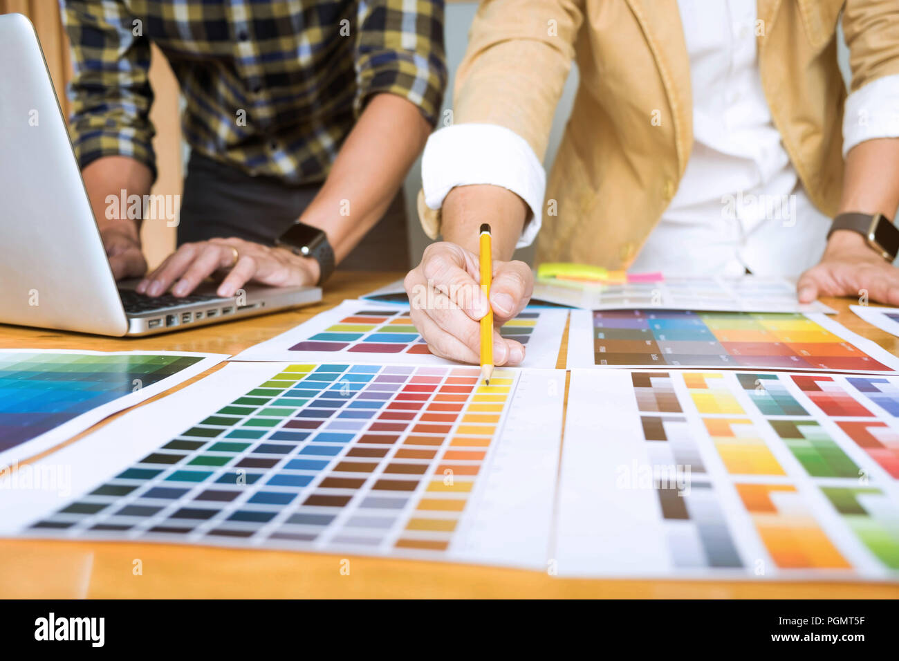 Graphic designers choose colors from the color bands samples for design ...