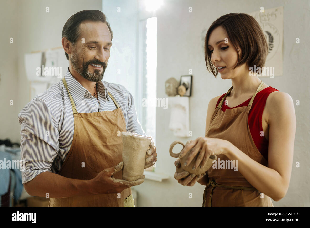 Woman watching man work hi-res stock photography and images - Alamy