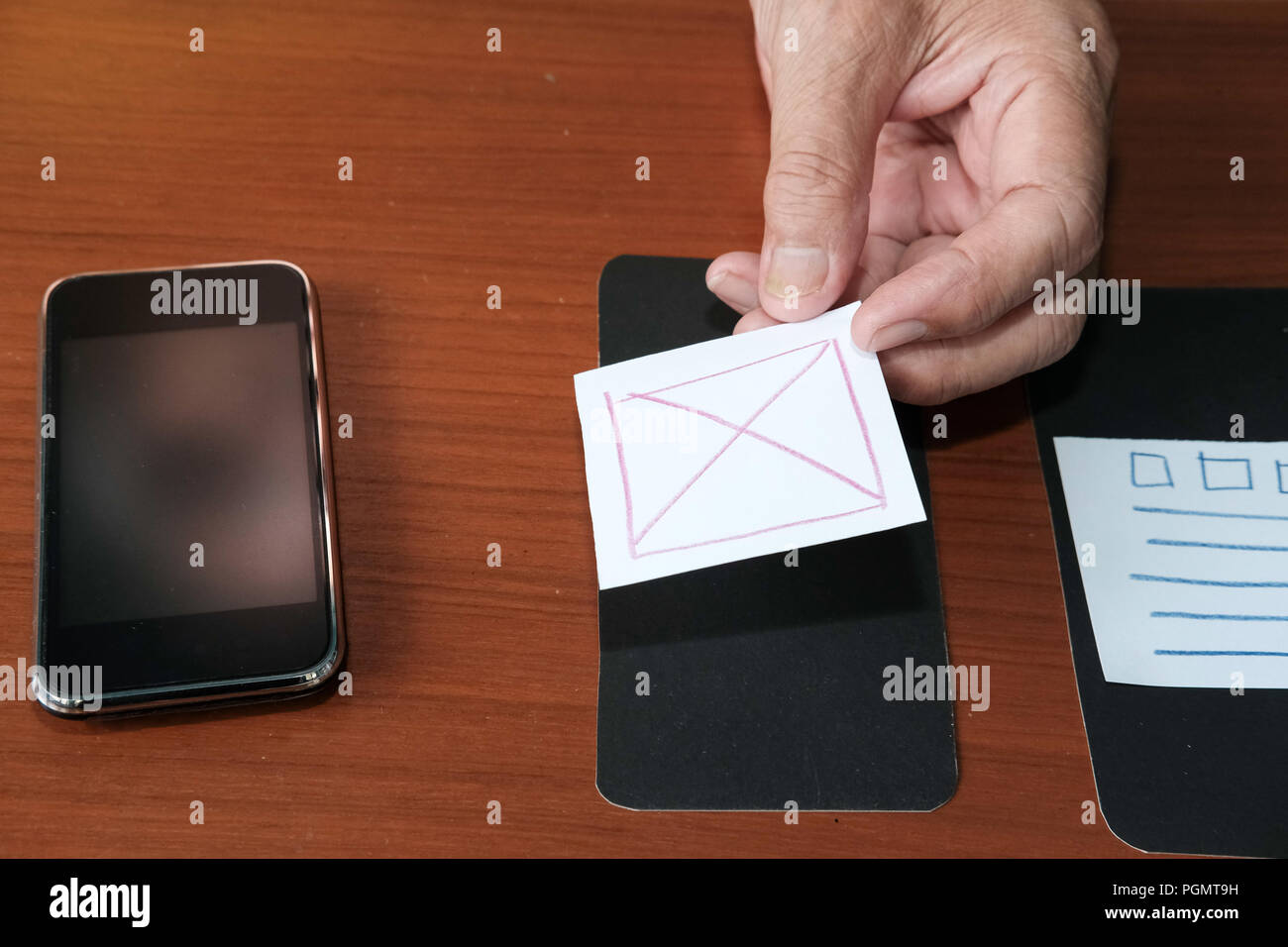 user experience (UX) designer designing web on smart phone layout. UI ...