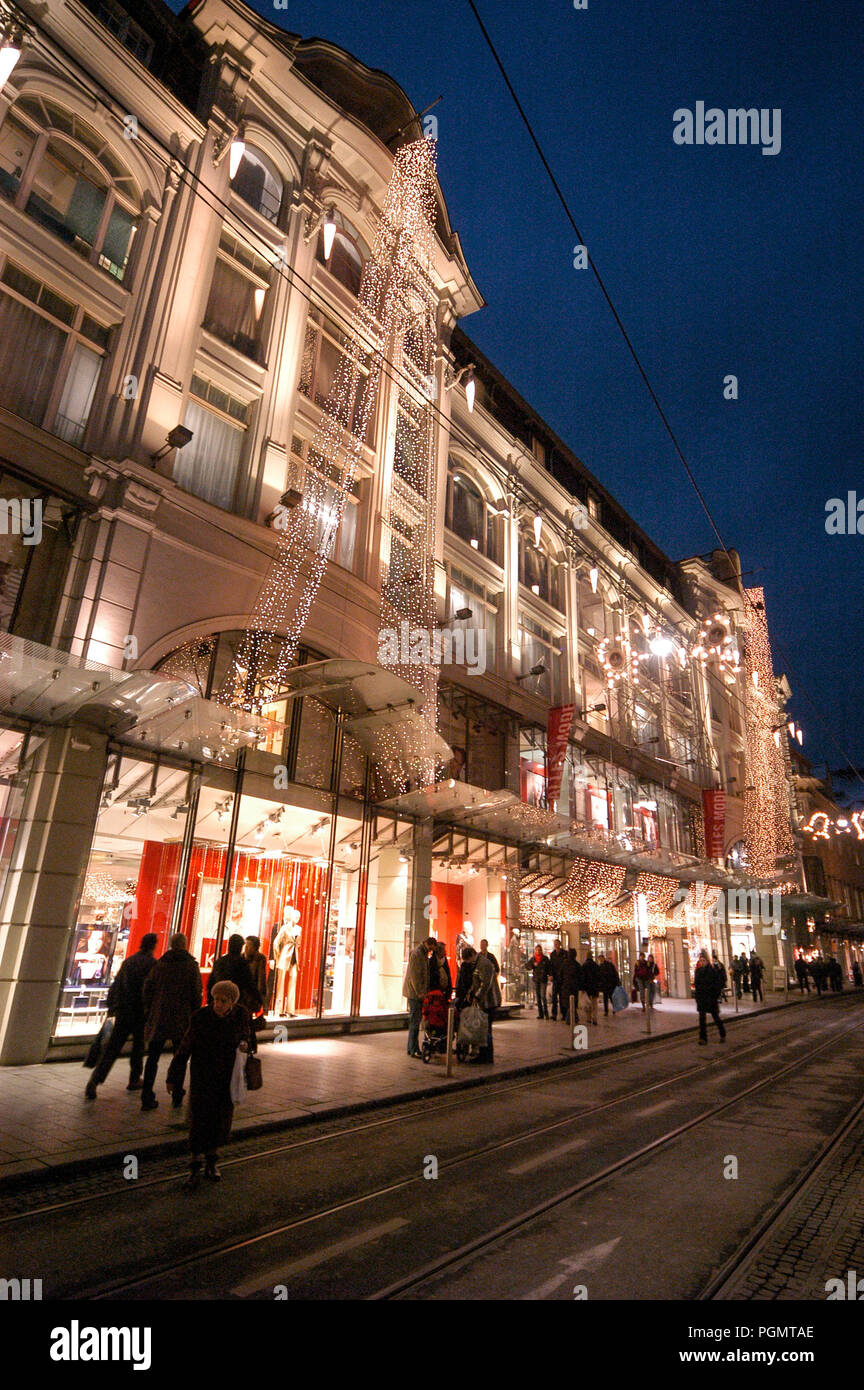 Christmas shopping with a big store decorated with Christmas lights in ...