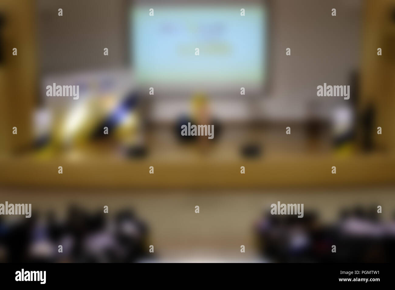 stage & presentation screen in seminar conference room. blur background ...