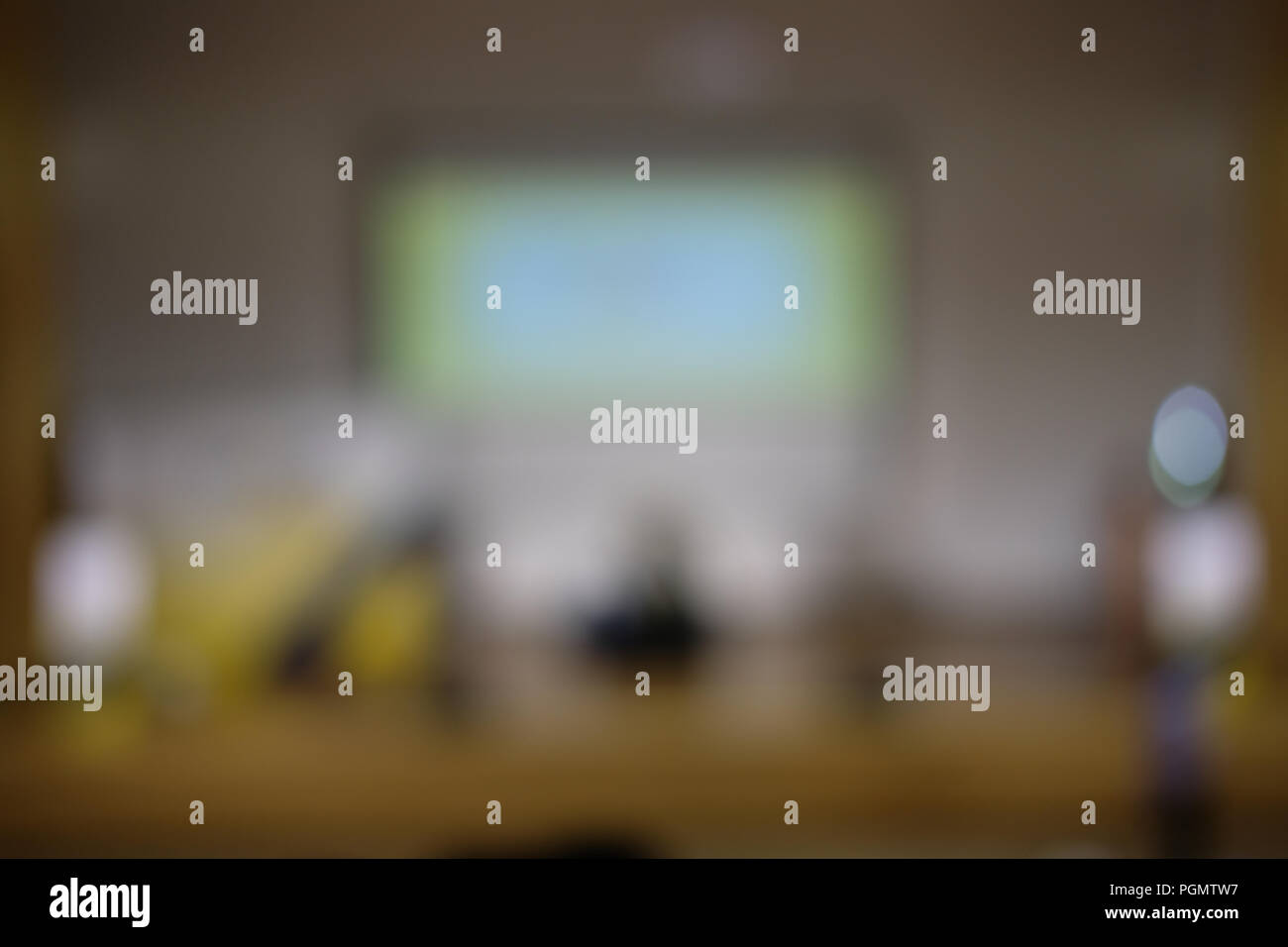 stage & presentation screen in seminar conference room. blur background ...