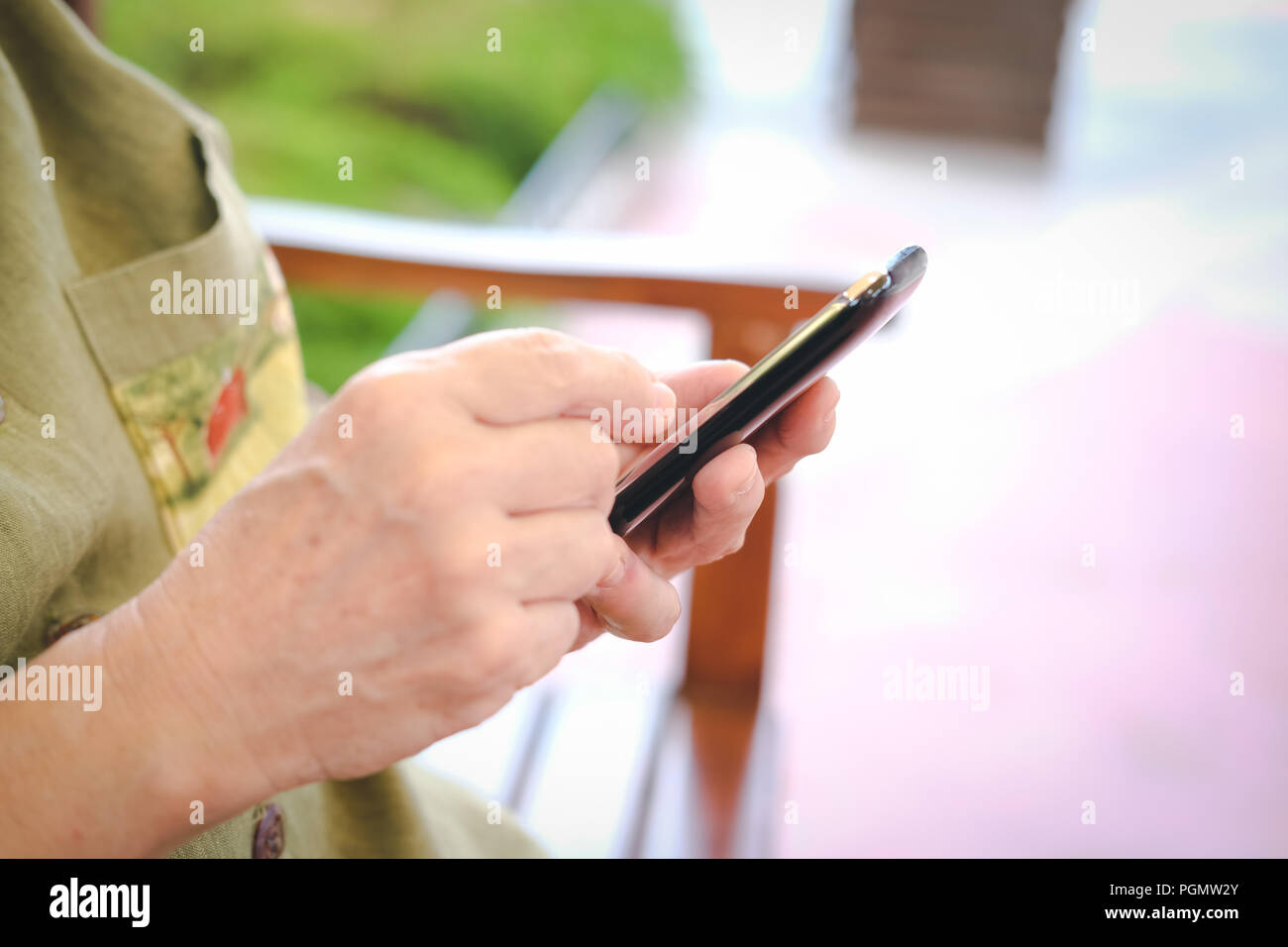 woman holding mobile phone. hand texting message, using app with ...