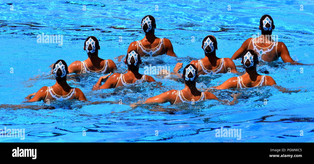 Synchronized swimming team performing a synchronized routine of ...