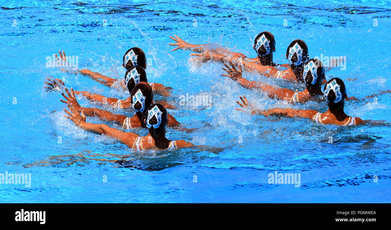 Synchronized swimming team performing a synchronized routine of ...