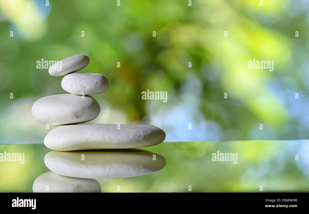 stack of white pebble stones with reflexion Stock Photo - Alamy